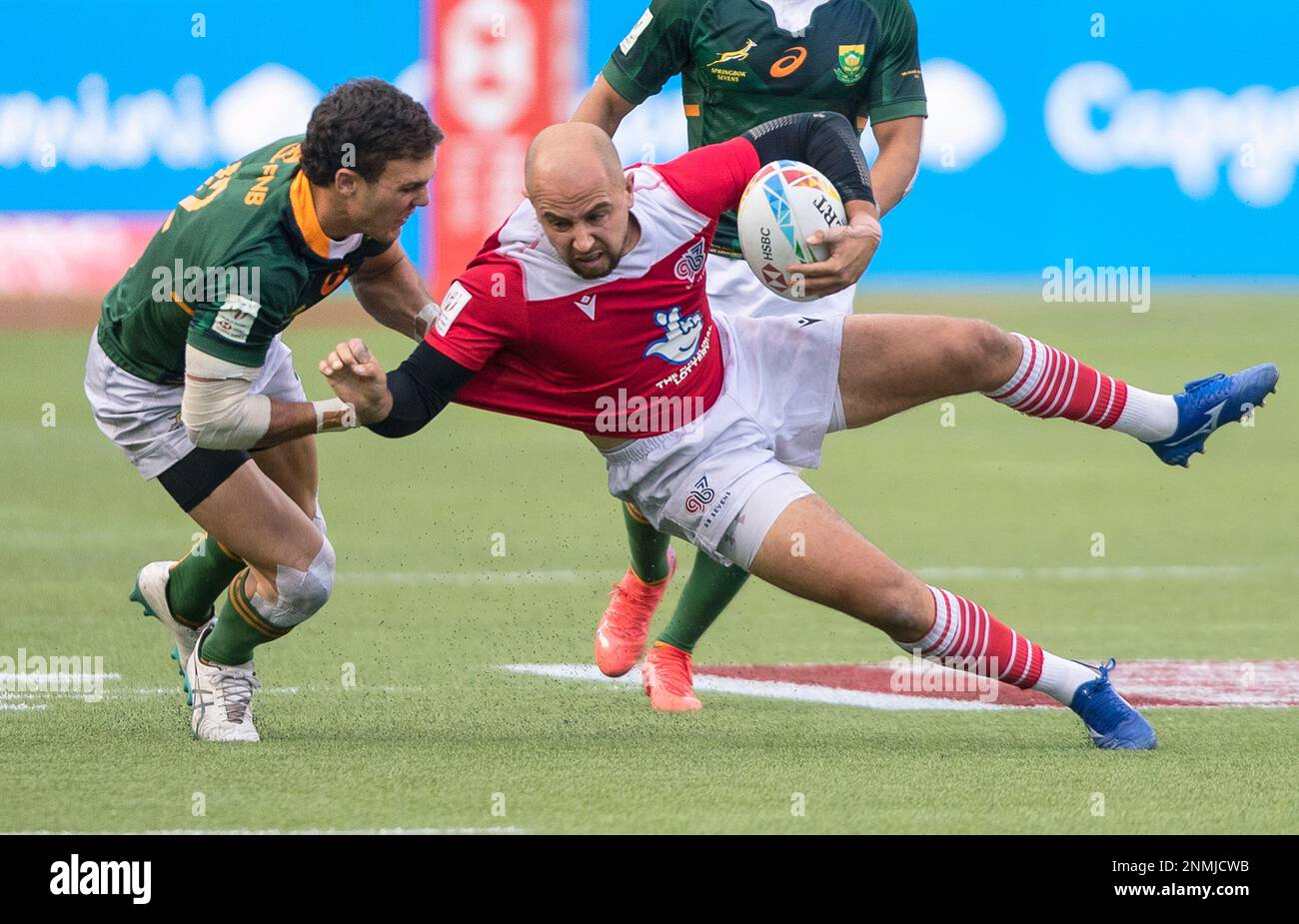 South Africa's South Africa's Muller du Plessis, left, tackles Britain ...