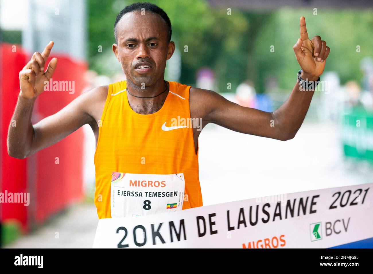 Ethiopia's Daba Ejerssa Temesgen celebrates as he crosses the finish ...