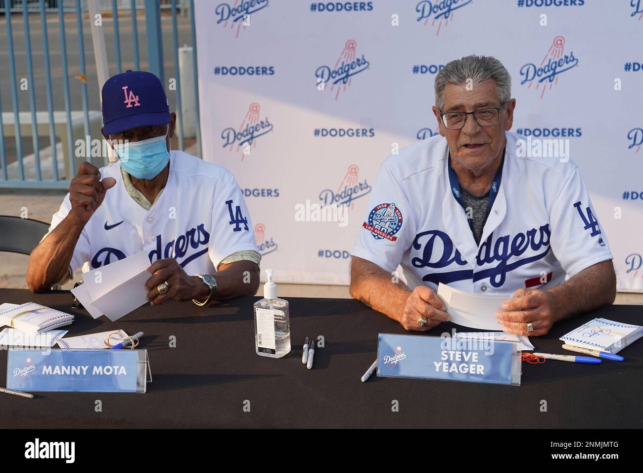 Former Los Angeles Dodgers players Manny Mota (left) and Steve Yeager pose during a MLB game ...