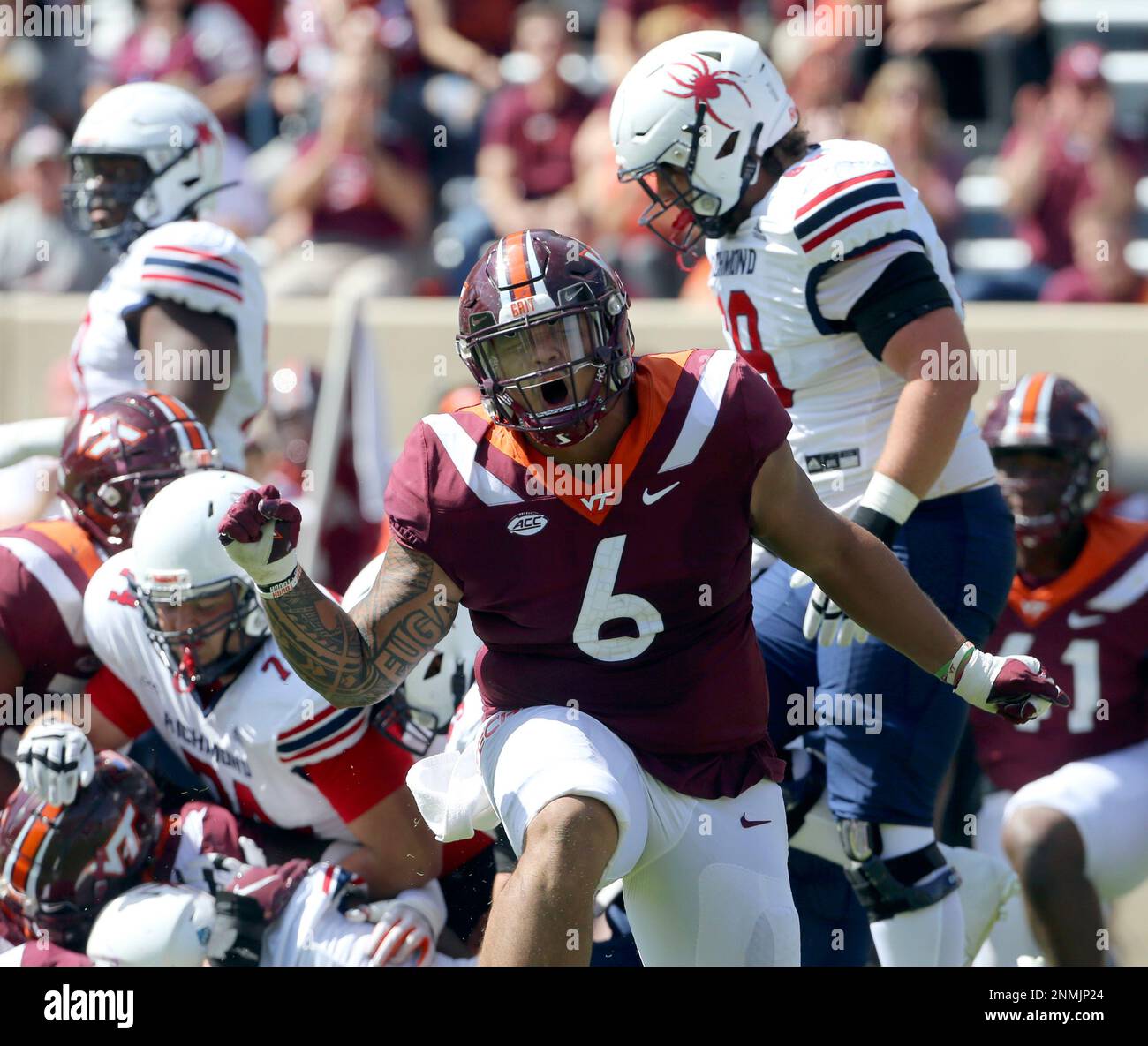 Virginia Tech defensive lineman Josh Fuga (6) celebrates a defensive ...