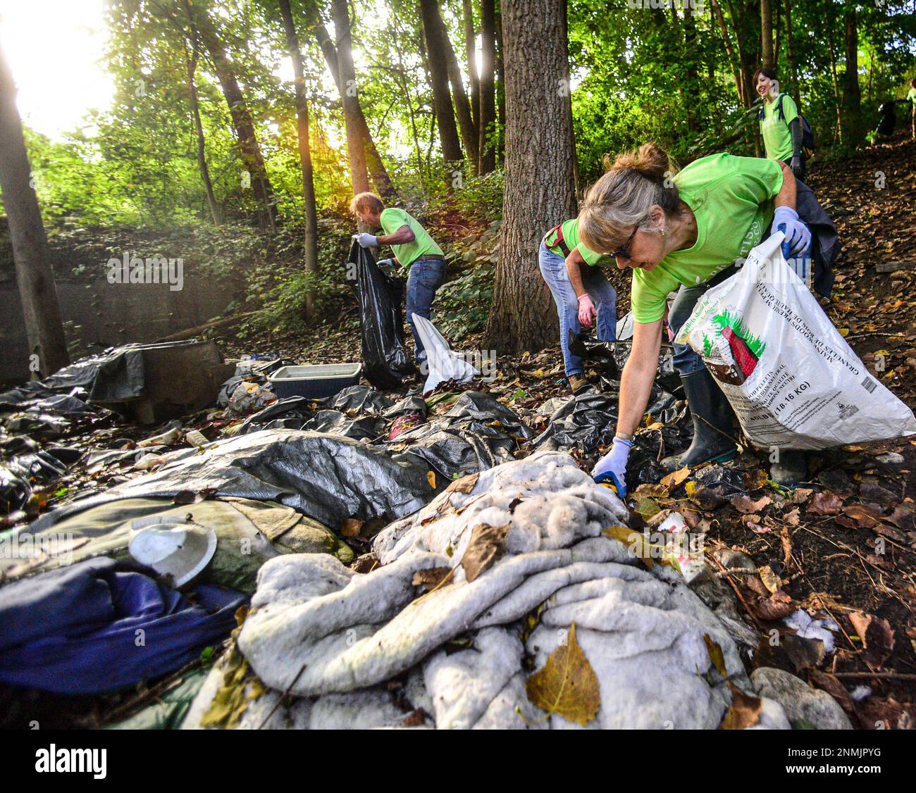 Volunteers from Prentiss Smith & Company help clean up the homeless ...