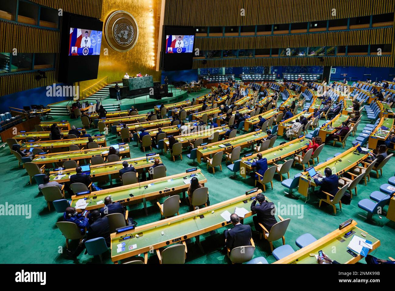 Philippines President Rodrigo Roa Duterte is seen on video screens as ...