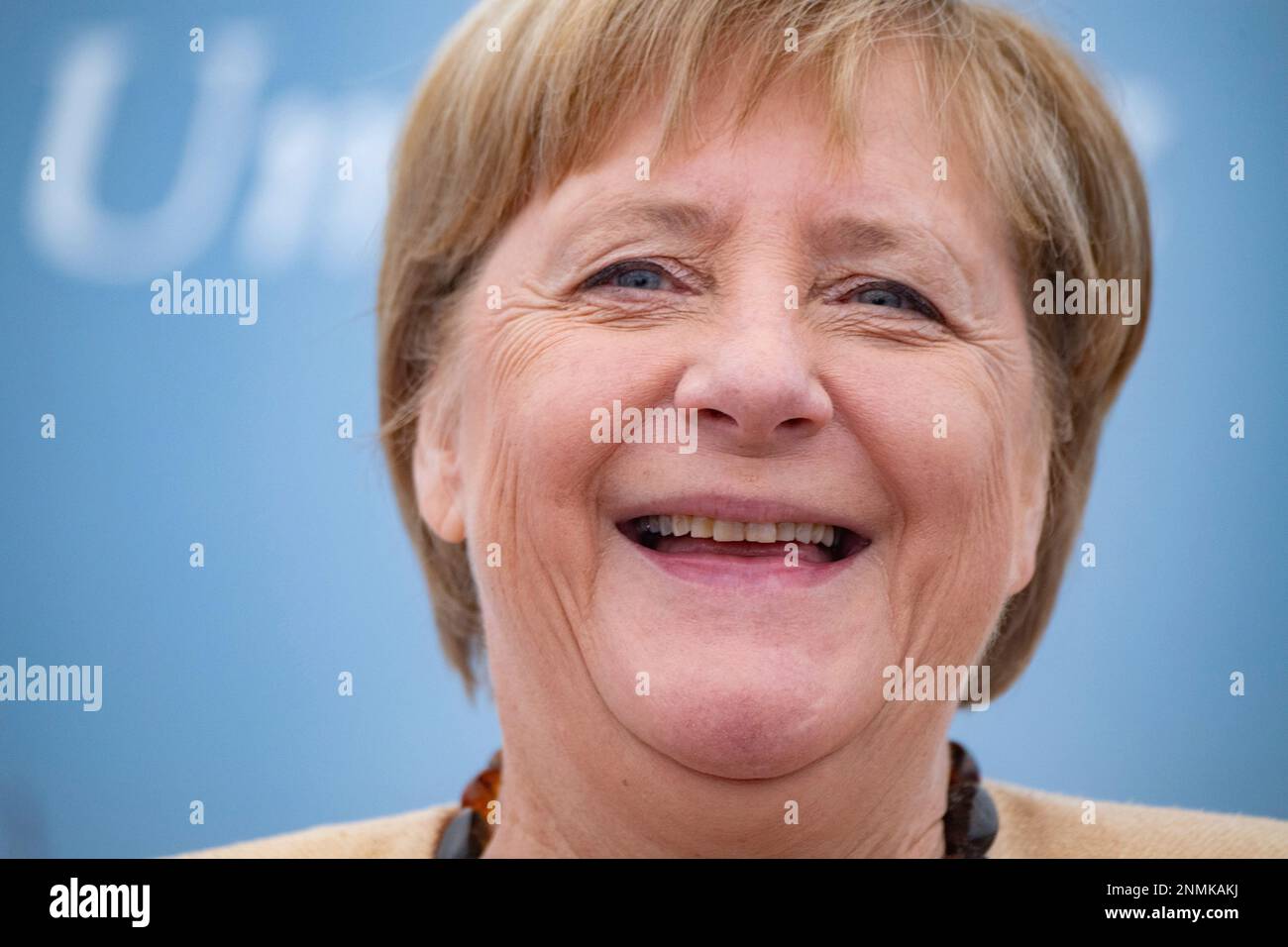 German Chancellor Angela Merkel smiles as she visits the fishing ...