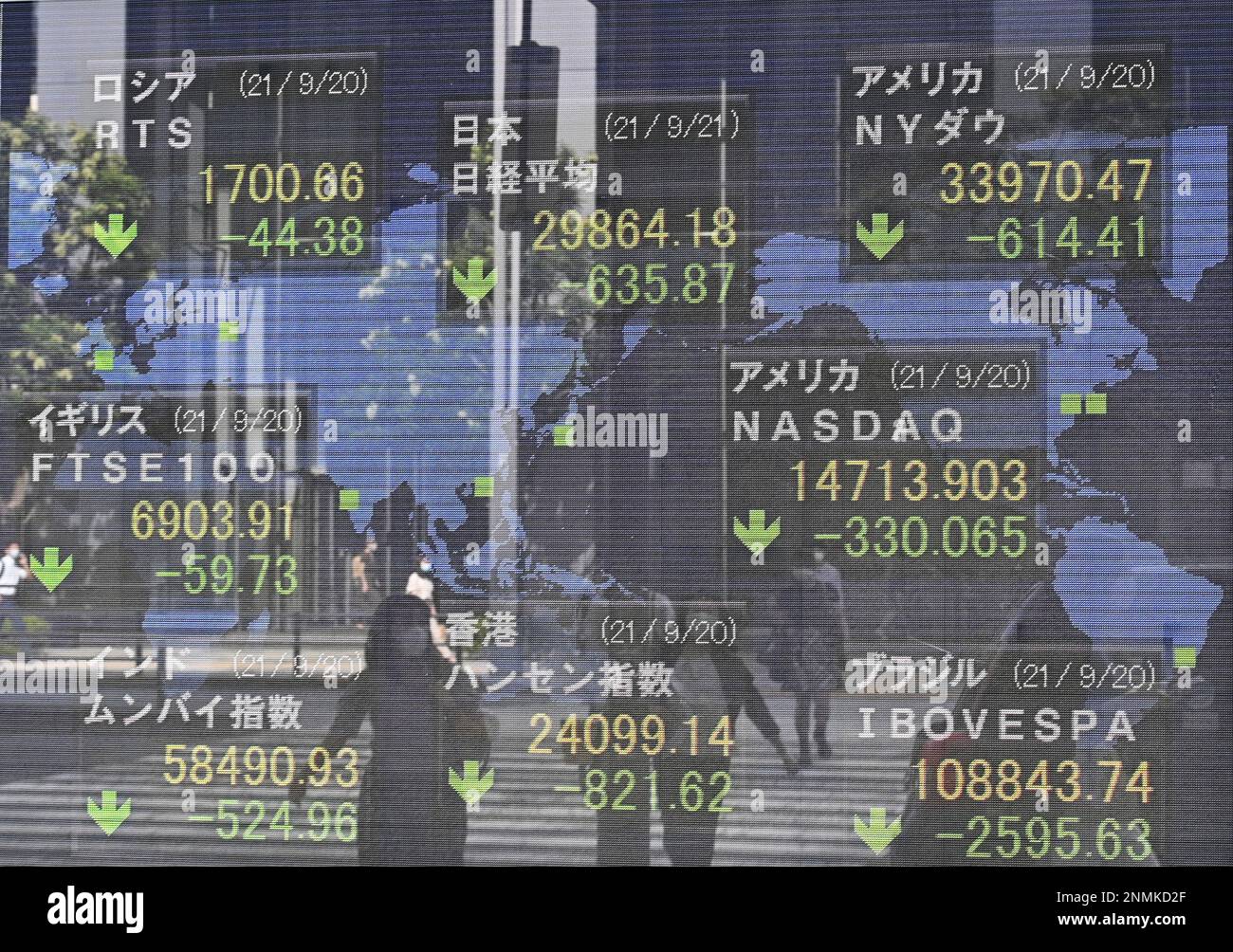An electric board shows the Nikkei Stock Average price (upper middle ...