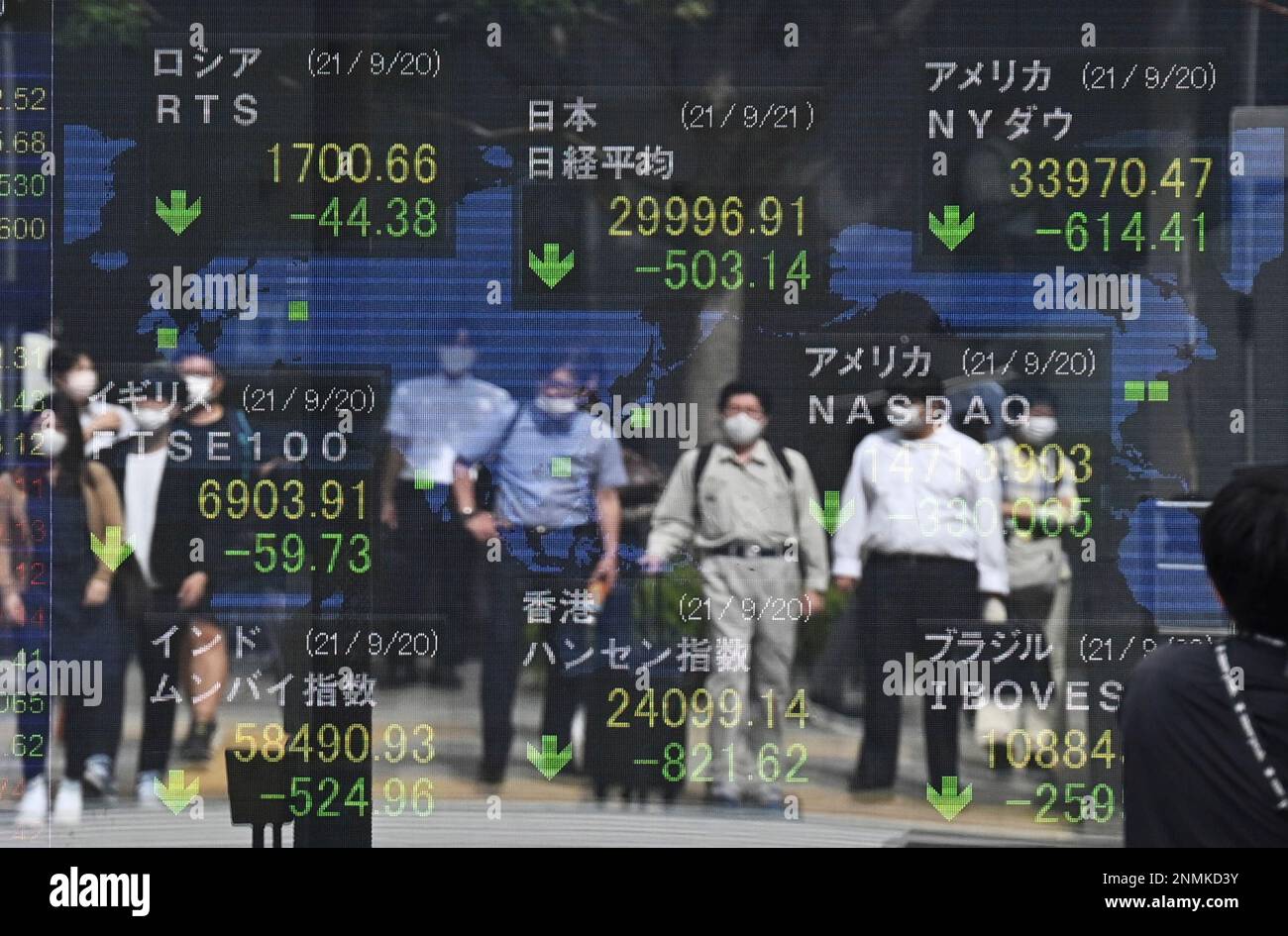 An electric board shows the Nikkei Stock Average price (upper middle ...