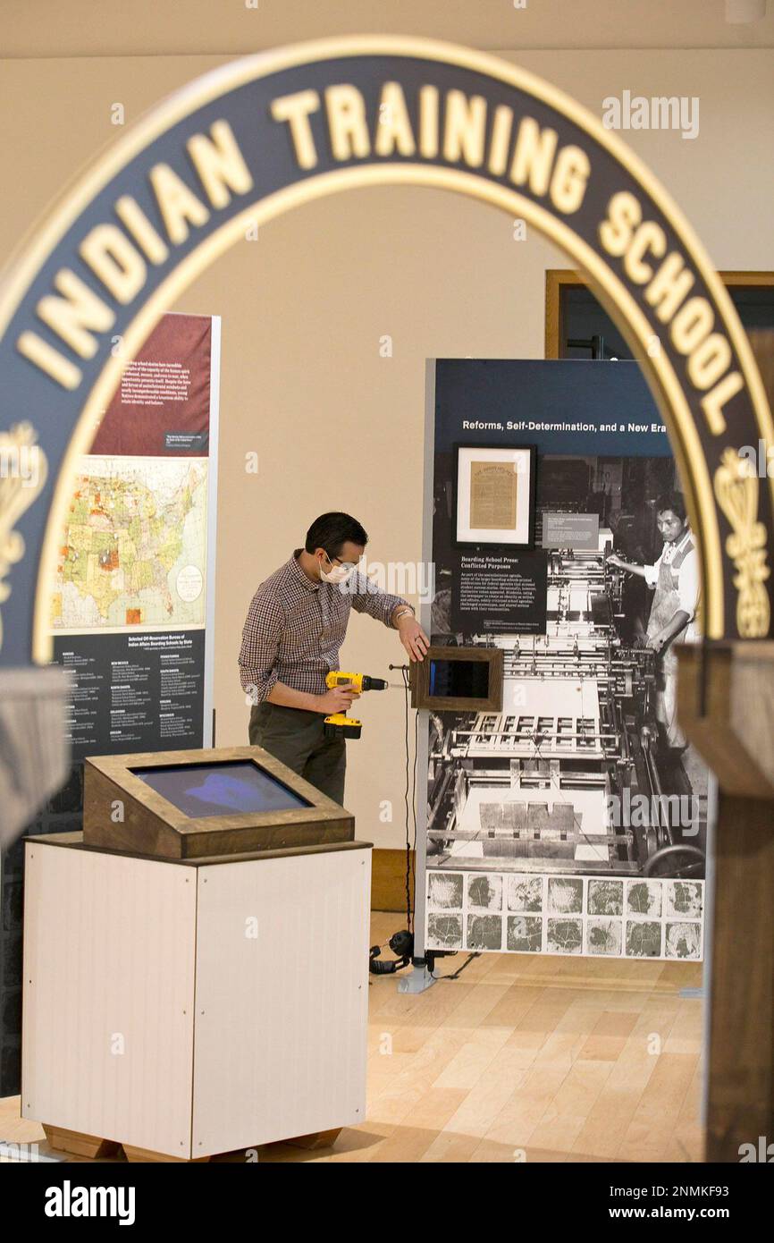 Dennos Museum Center Director Craig Hadley works on the "Away From Home ...
