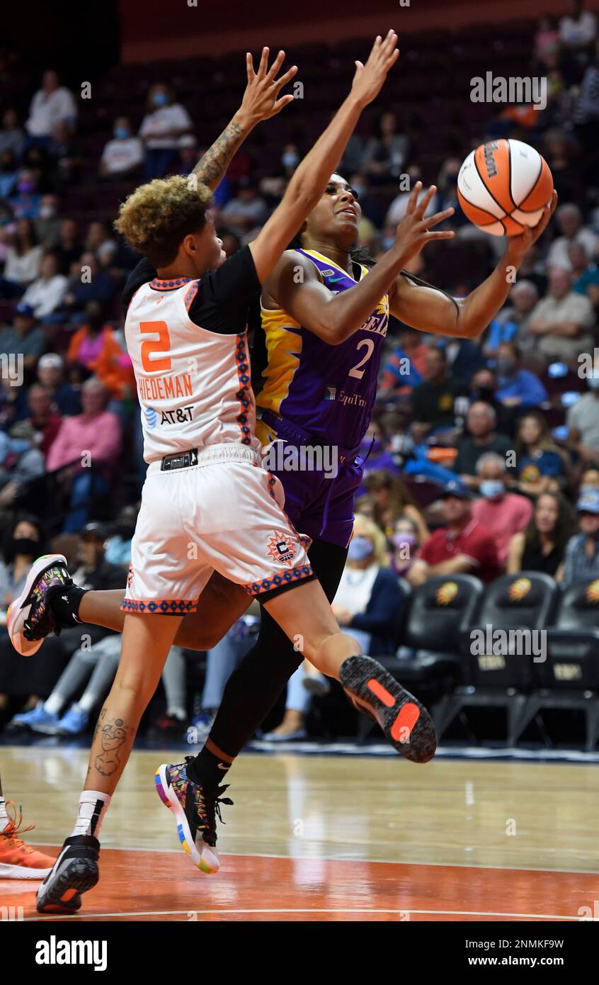 Los Angeles Sparks guard Te'a Cooper is fouled on a drive by ...
