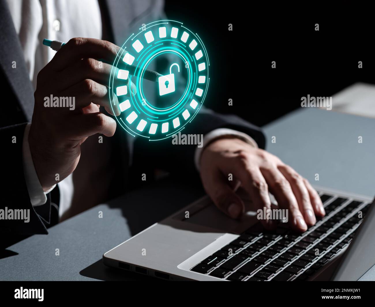 Man in office suit sitting at the table with lap top and typing text ...