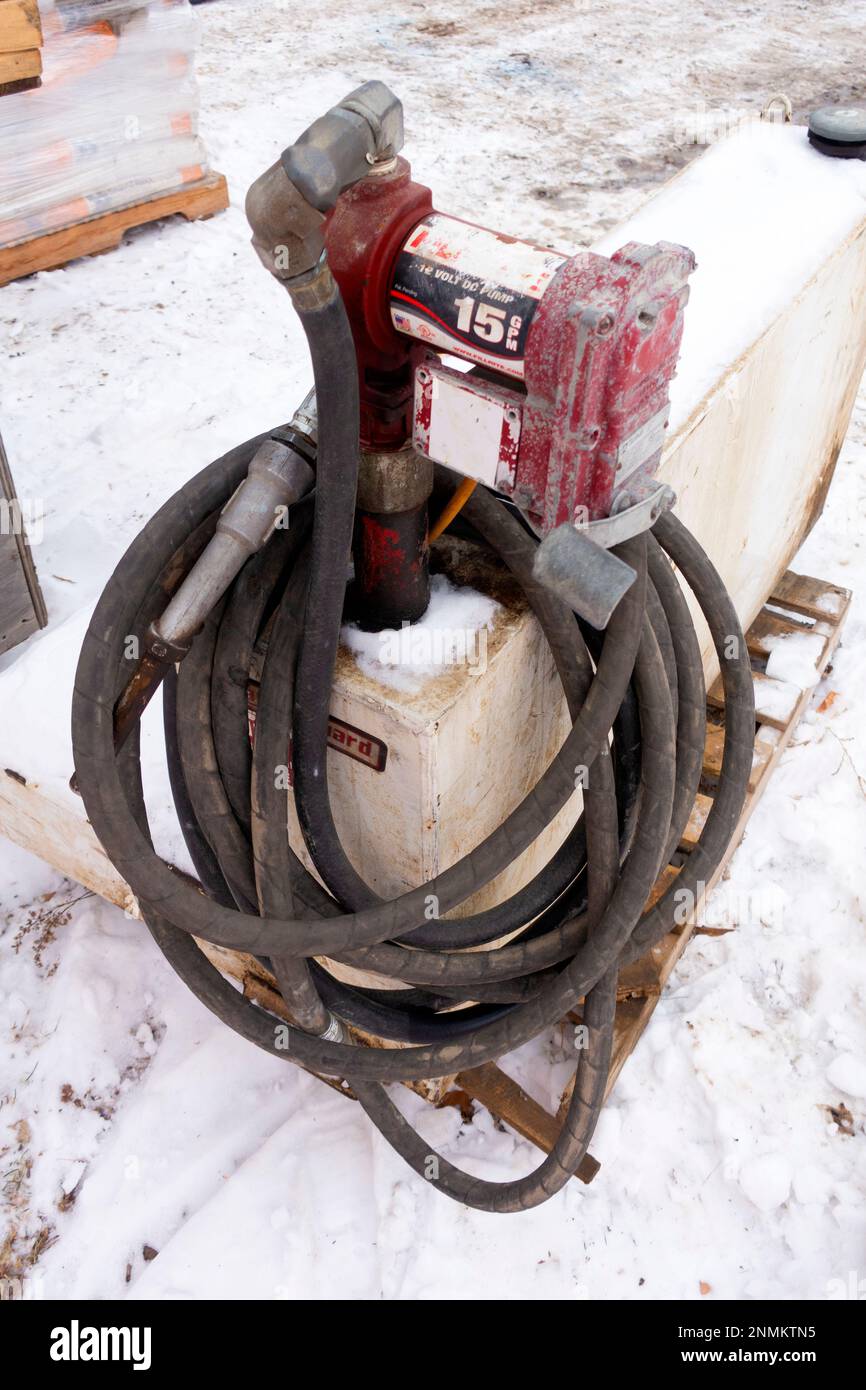 Looped heavy duty hose attached to a 12 volt DC pump on a construction ...