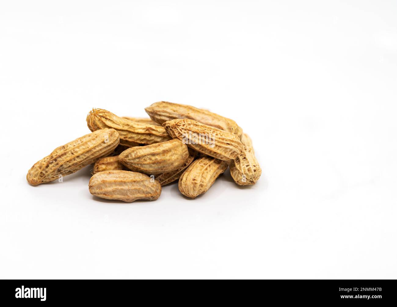 Close up stream peanuts, smalll heap of peanuts with shell, side view ...