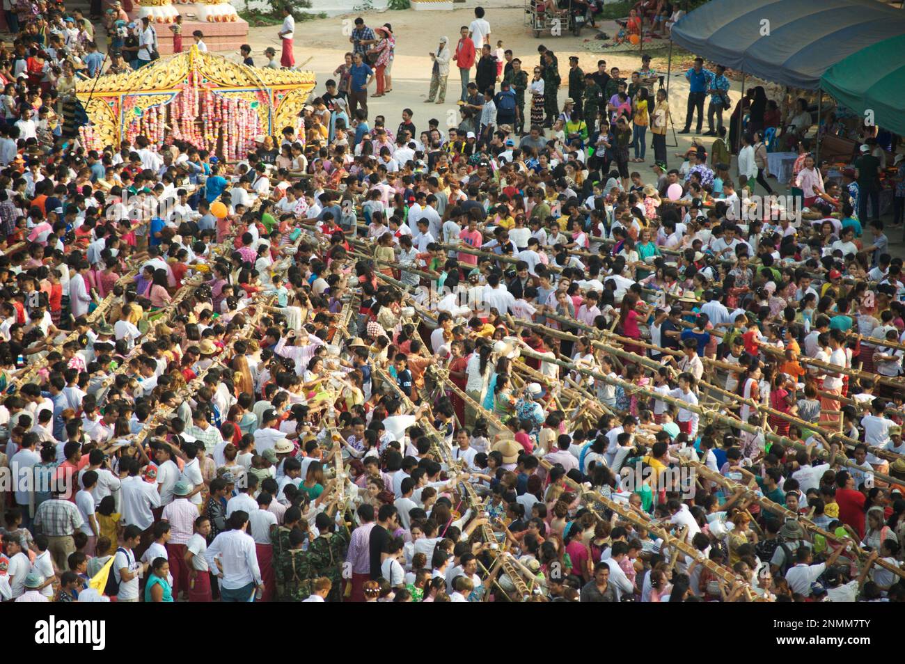 Large group of unidentified Thai-Mon minority pour water for monks by ...