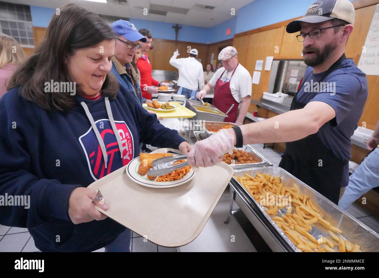 St. Louis, United States. 24th Feb, 2023. Customers are served cod fish ...