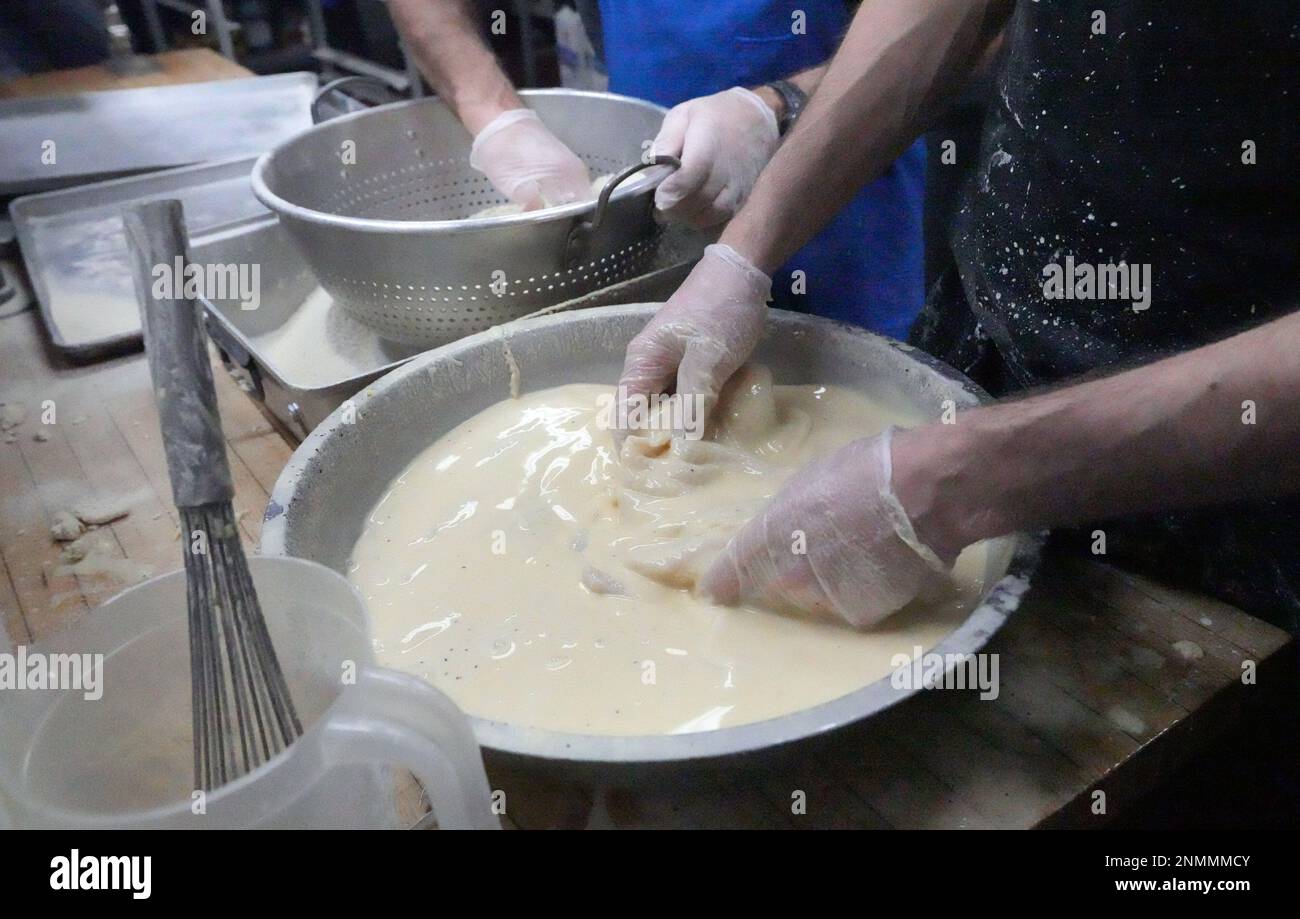 St. Louis, United States. 24th Feb, 2023. Cook Danny Sommer, soaks cod ...