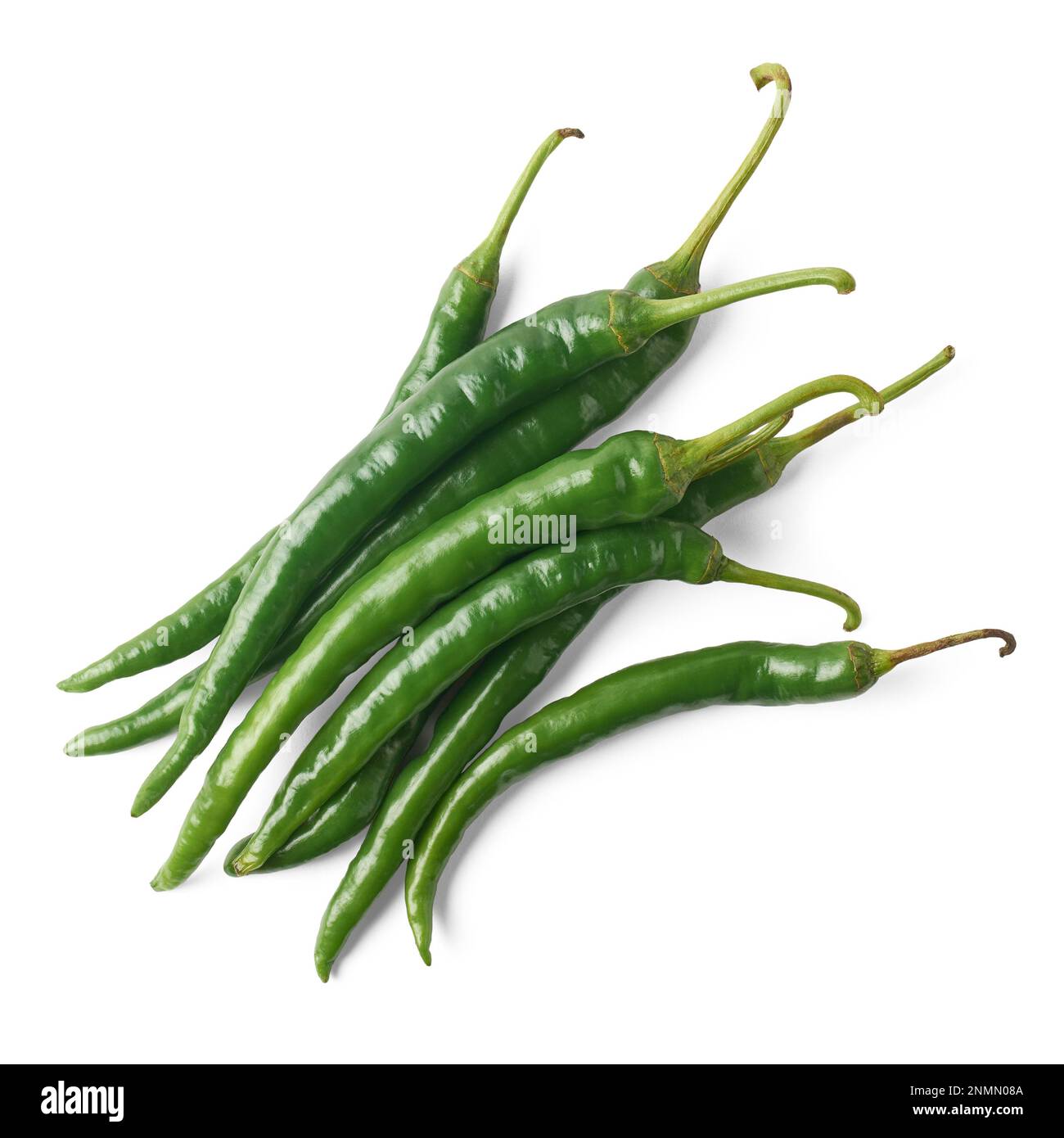 pile of green chillies isolated on white background, common vegetable ...