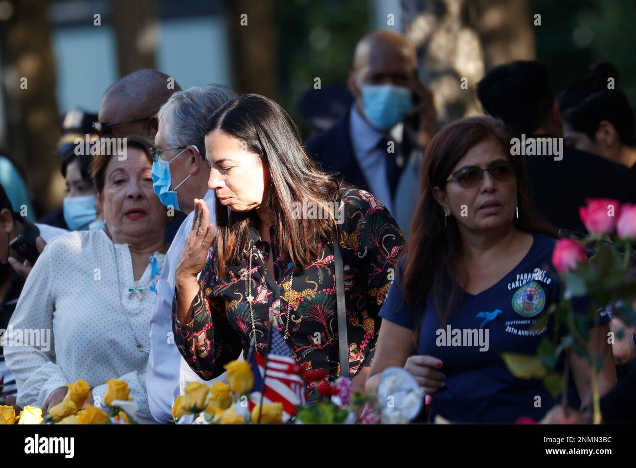 People visit the 9/11 Memorial during ceremonies to commemorate the ...