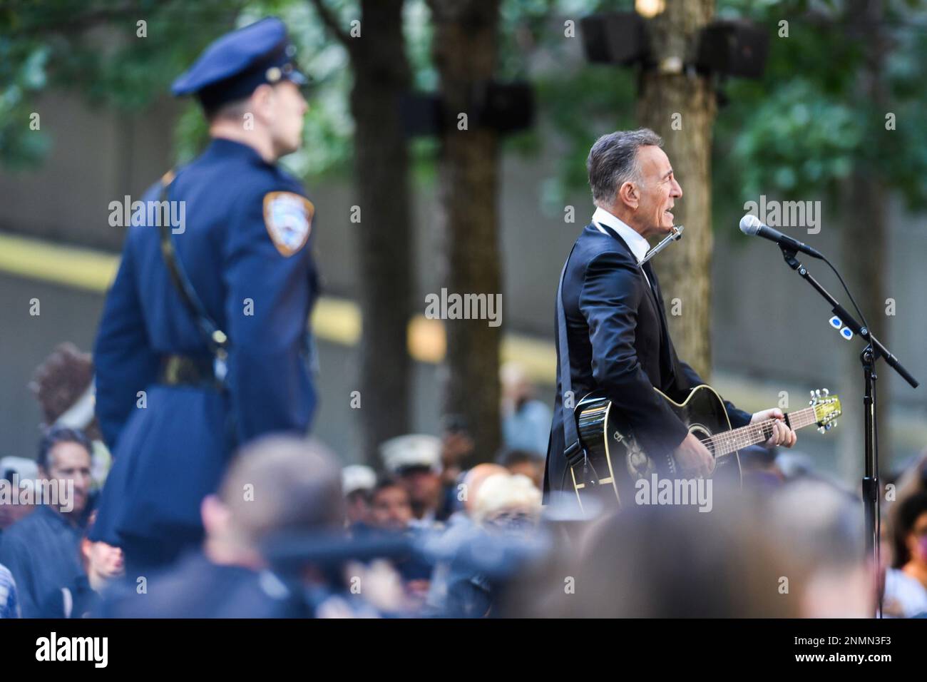 Bruce Springsteen, right, performs during ceremonies to commemorate the ...