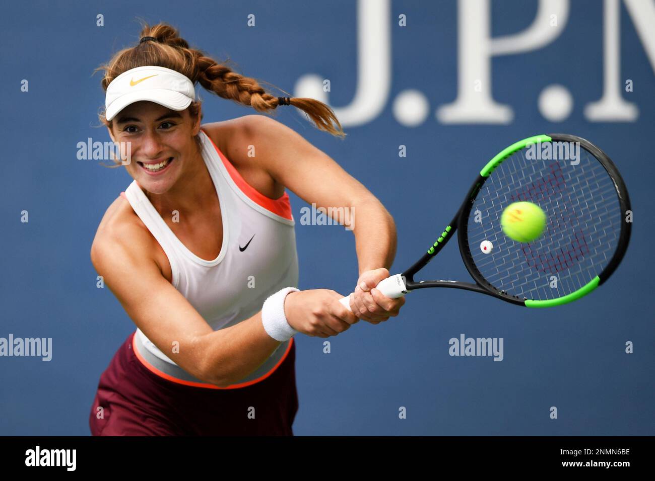 Solana Sierra returns a shot during a Junior Girls' Singles semifinal ...