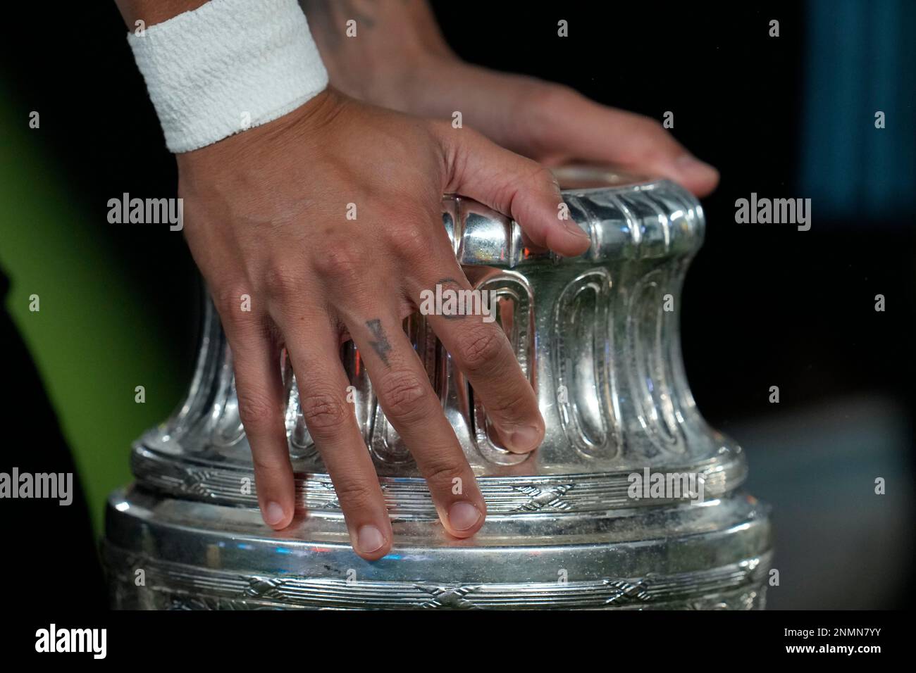 Argentina's Angel Di Maria touches the Copa America trophy, at the end ...