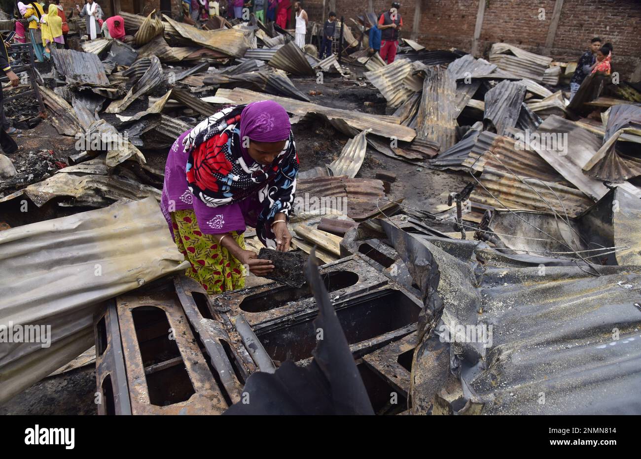 Guwahati, Guwahati, India. 24th Feb, 2023. A woman search for remains ...