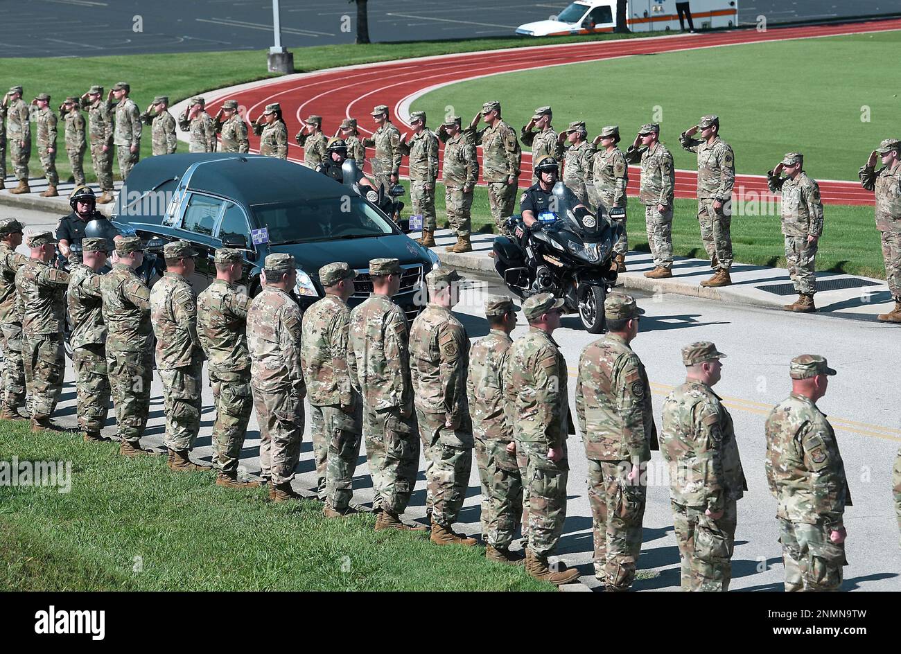 McGhee Tyson Air Base personnel salute as the funeral procession for ...