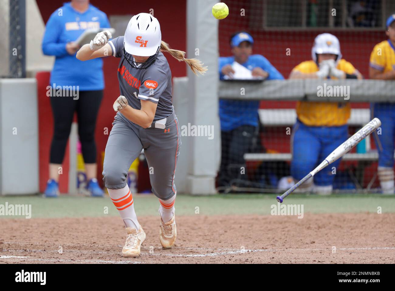 Sam Houston State batter Emily Telg tries to avoid touching her ...