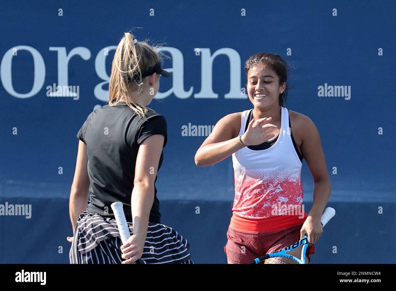 Dana Guzman and Linda Klimovicova react during a Junior Girls' Doubles ...
