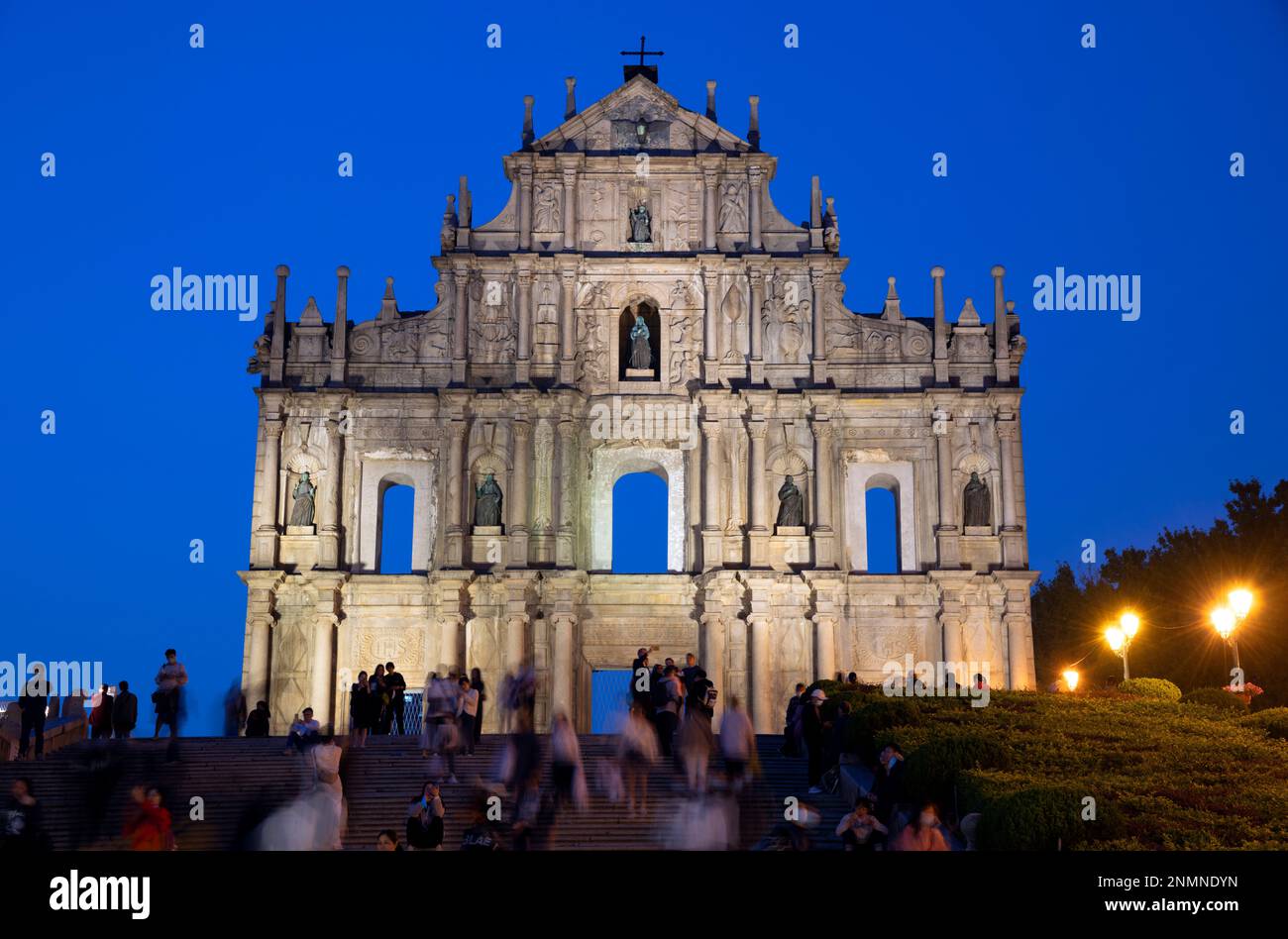 Tourists visiting the famous ruins of Sao Paulo cathedral, Macau, China ...