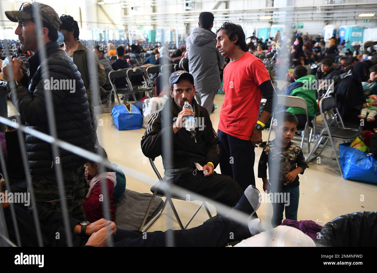 Afghan refugees are processed inside Hangar 5 at the Ramstein U.S. Air ...