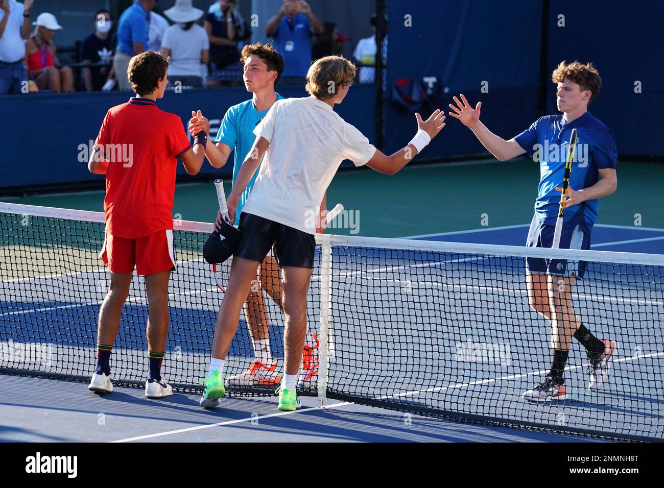 Nicholas Godsick and Ethan Quinn high five Philip Florig and Max Hans ...
