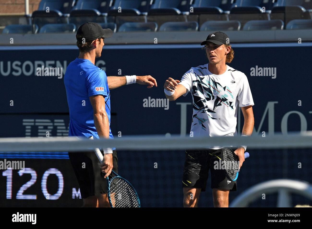 Max Purcell and Matthew Ebden high five during a Men's Doubles ...