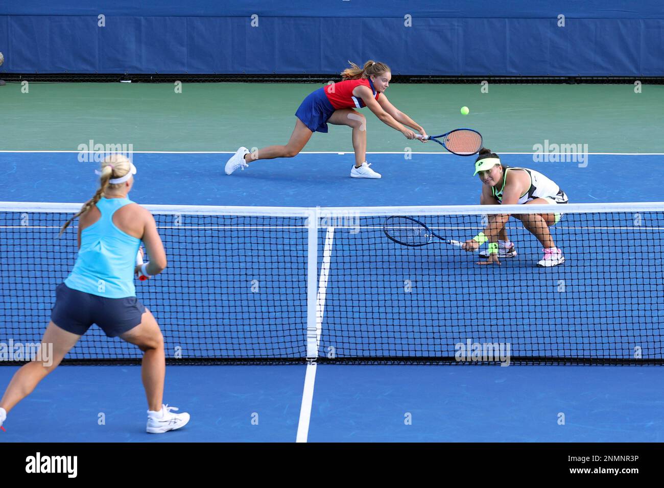 Matilda Mutavdzic returns a shot during a Junior Girls' Doubles match ...