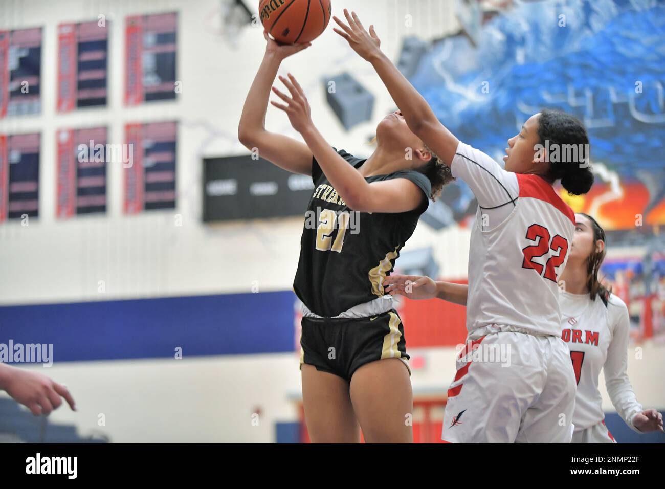 USA. Player putting up shot while closely defender by an opponent Stock ...