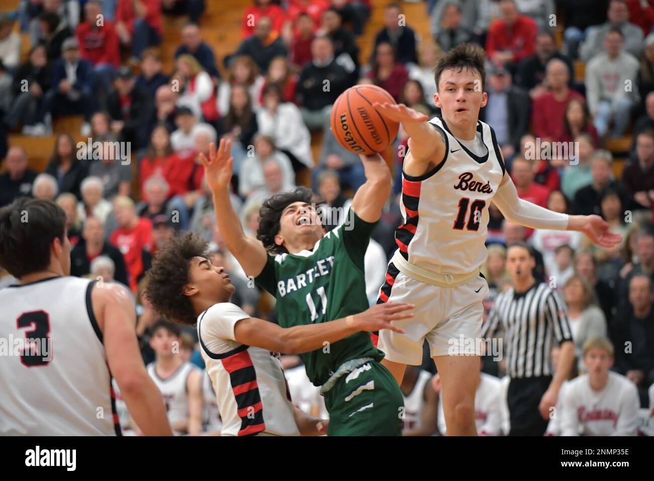 USA. Following a shot being deflected a trio of players react in an ...