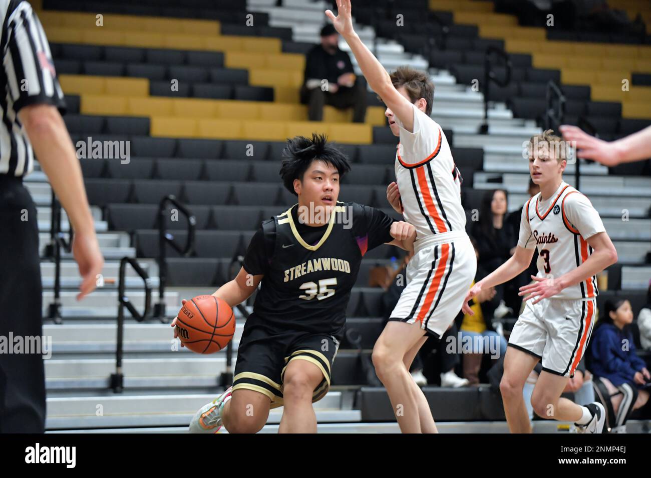USA. Player attempting to dribble around a defender while seeking a ...