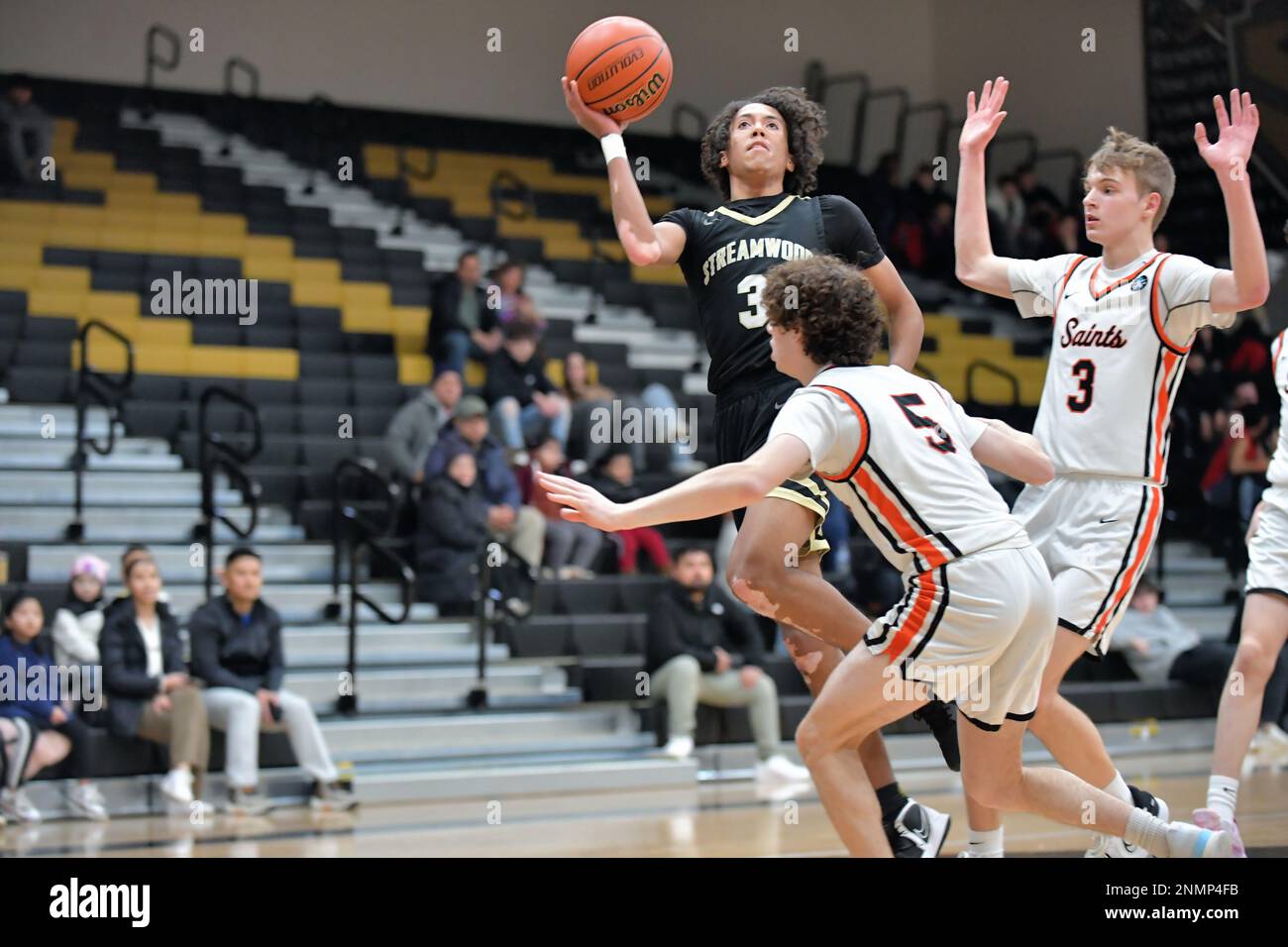 USA. Player getting off a long shot over a defender while pursued by a ...
