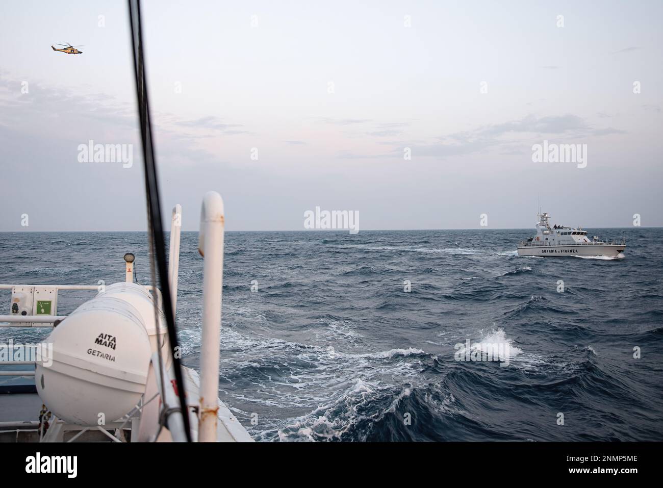 Sar Italy, Italy. 24th Feb, 2023. A Guardia di Finanza vessel and a ...