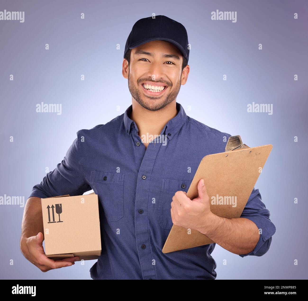 Delivery man, box and portrait isolated on studio background with ...