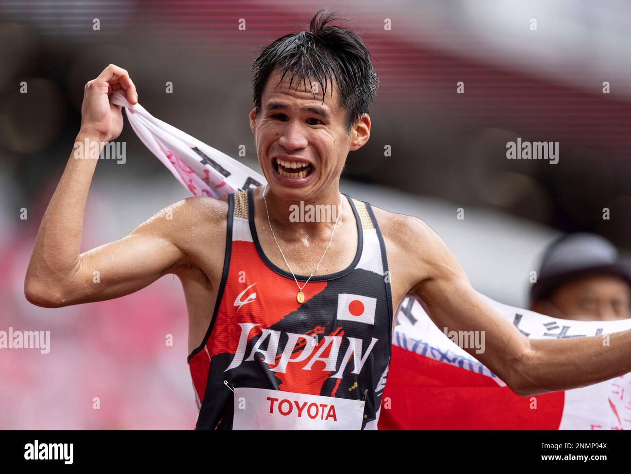 Tadashi Horikoshi of Japan wins the bronze medal in the men's marathon ...