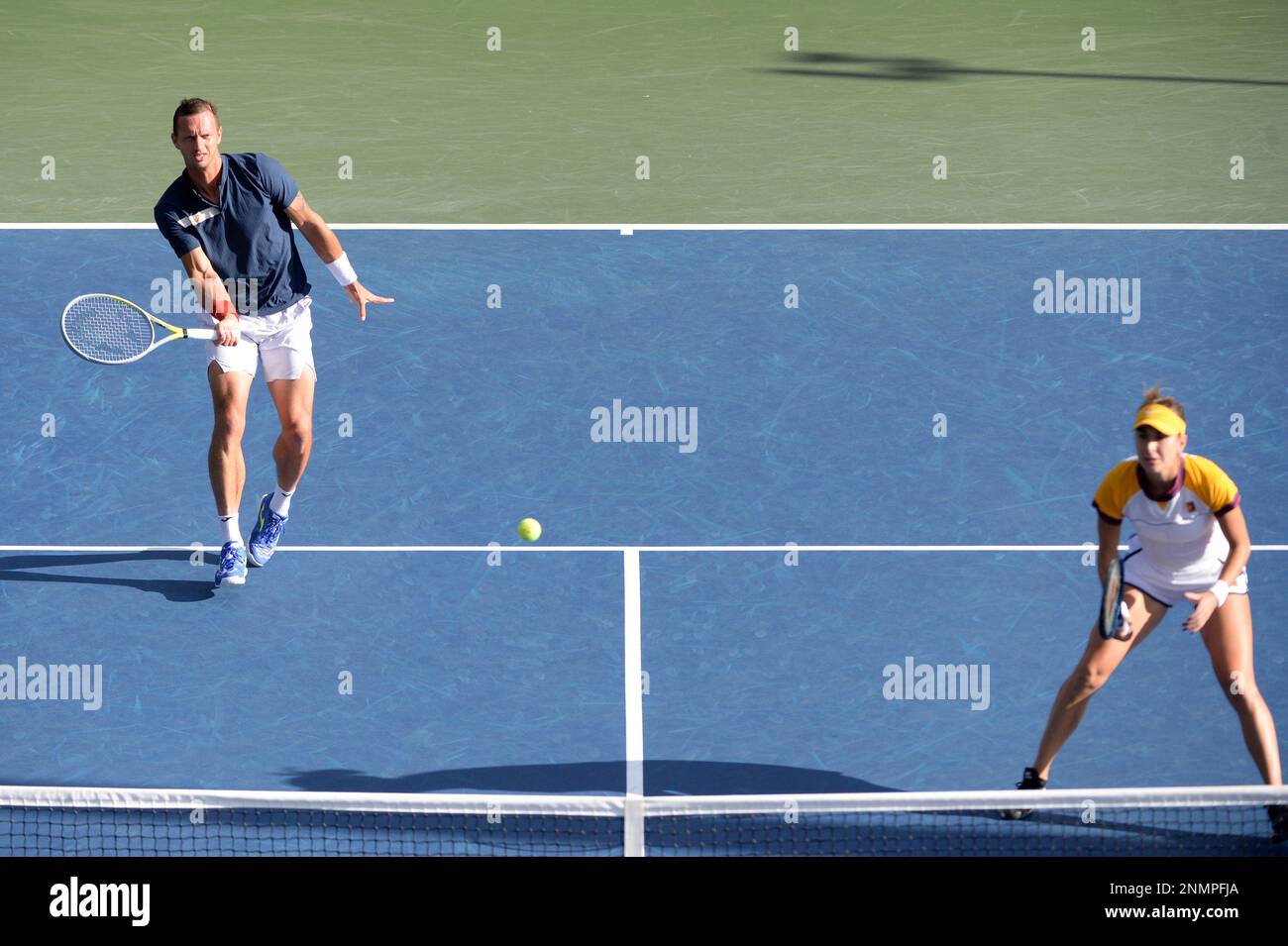 Filip Polasek and Belinda Bencic in action during a Mixed Doubles match ...