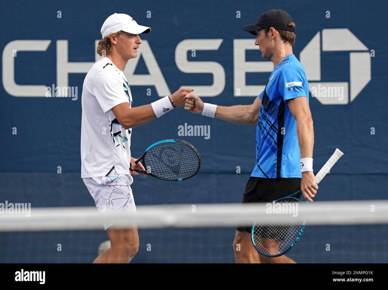 Max Purcell and Matthew Ebden high five during a Men's Doubles match at ...