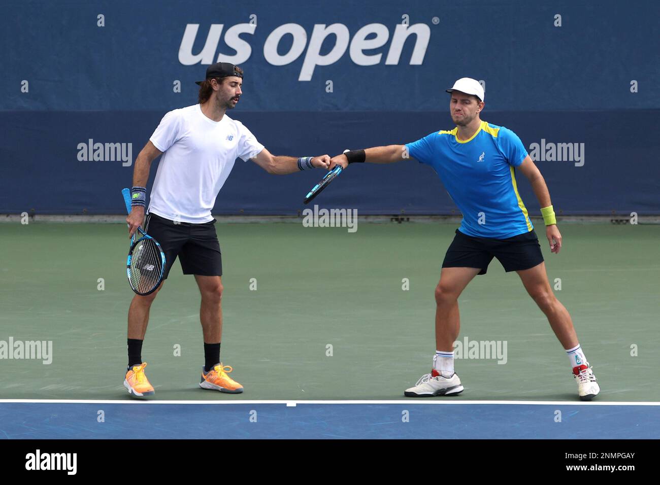 Jordan Thompson and James Duckworth high five during a Men's Doubles ...