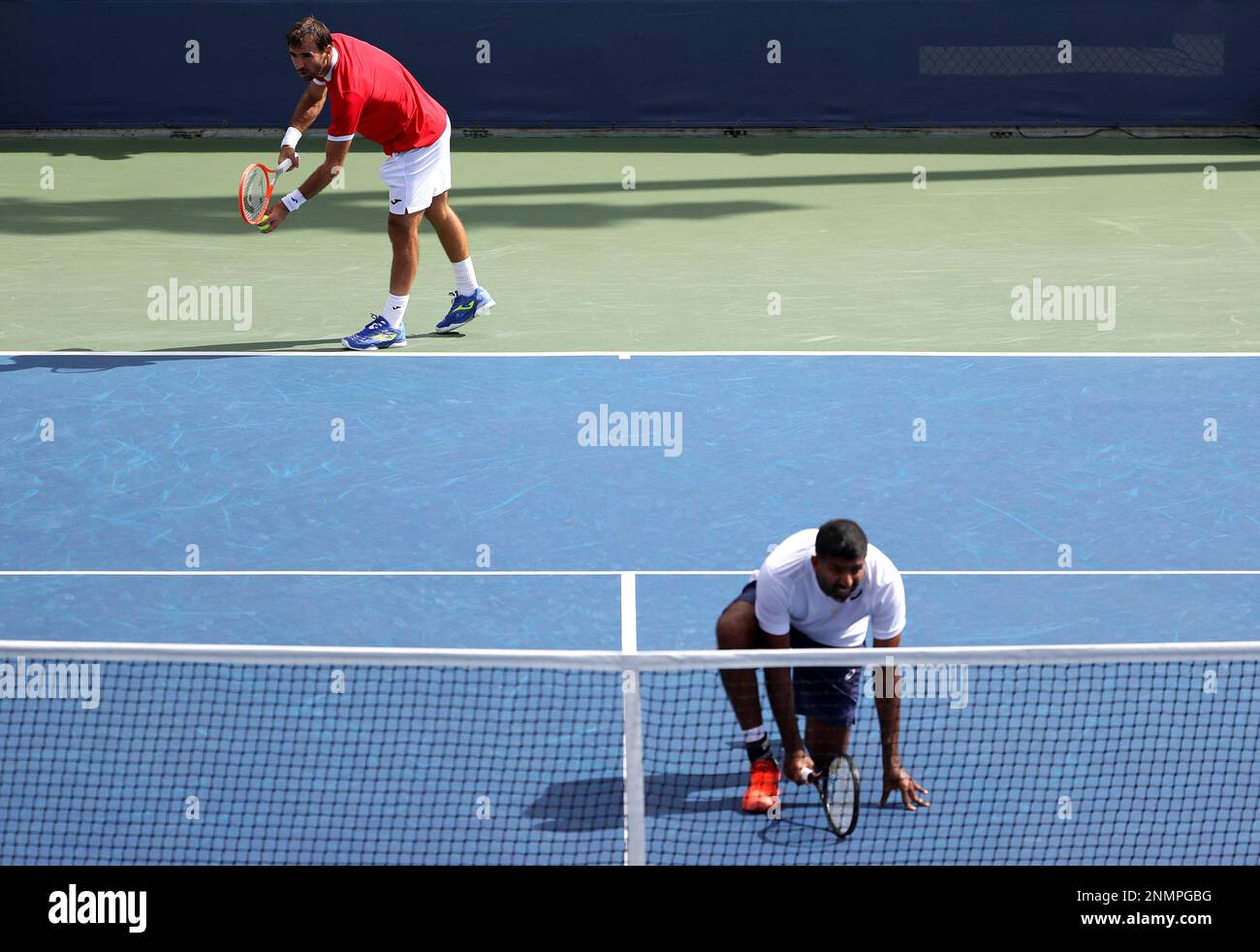 Ivan Dodig hits a serve during a Men's Doubles match at the 2021 US ...