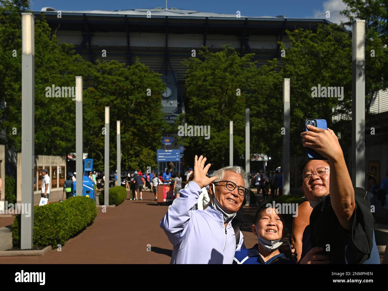 Spectators take a photo in front of Arthur Ashe Stadium at the 2021 US ...
