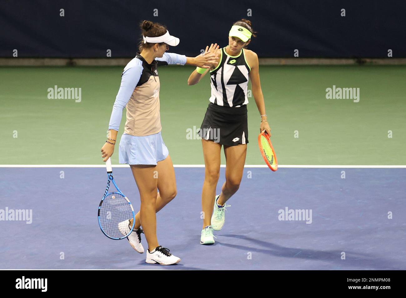 Andrea Mitu high fives Irina-Camelia Begu during a Women's Doubles ...