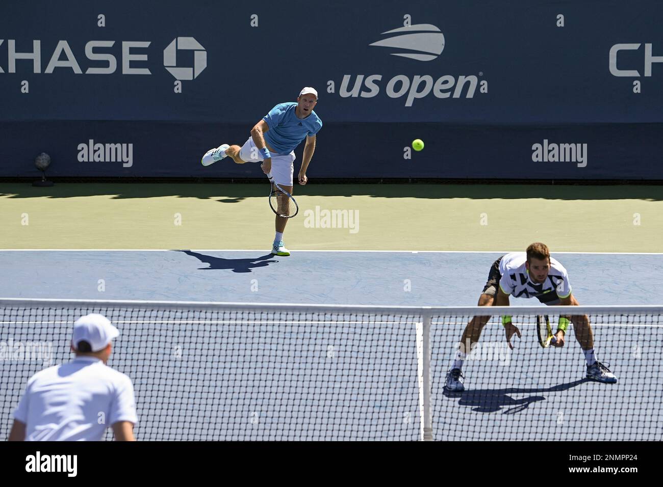 Dominic Inglot serves during a Men's Doubles match at the 2021 US Open ...