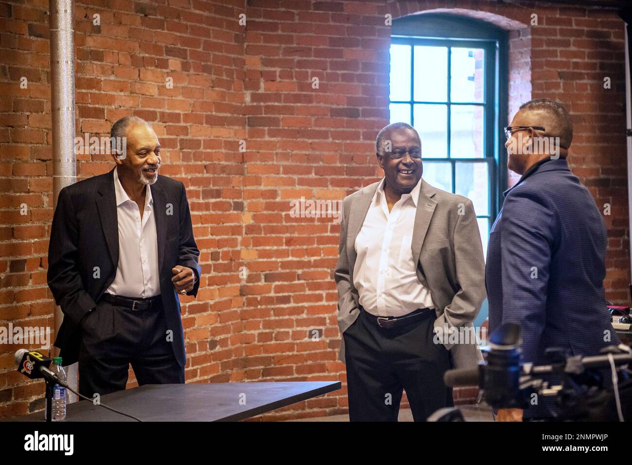 Dave Cash, Gene Clines and Roberto Clemente Jr., talk during an event ...