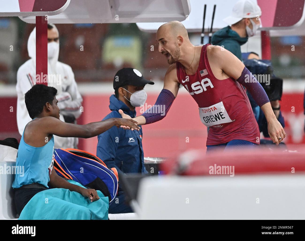 GREWE Sam (R) of the U.S.A shakes hands with a competitor after winning ...