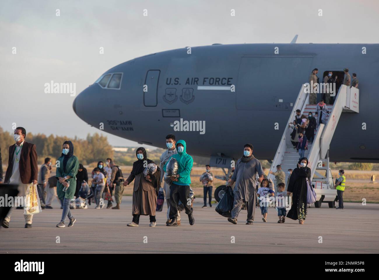 Afghan refugees arrive at the Rota Naval Base where they will be cared ...