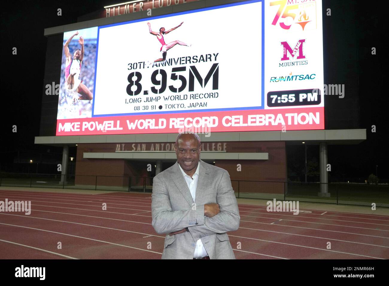 Mike Powell (USA) poses at a ceremony to commemorate the 30th ...