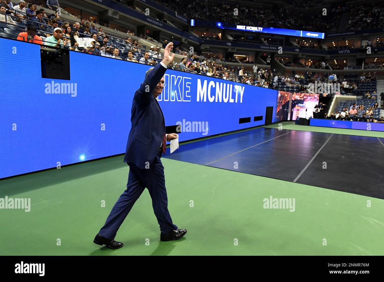 Mike McNulty walks onto the court before a Women's Singles match ...